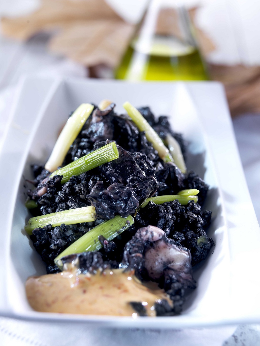 Black rice, baby cuttlefish and green garlic - Olive Oils from Spain