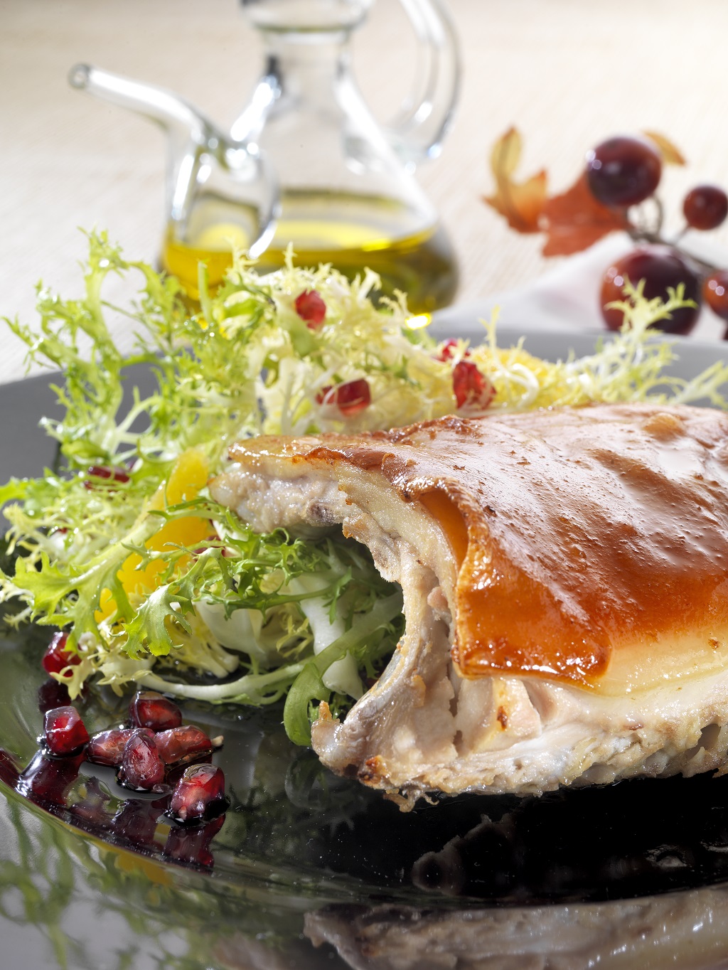 Roasted suckling pig with a chicory - Olive Oils from Spain